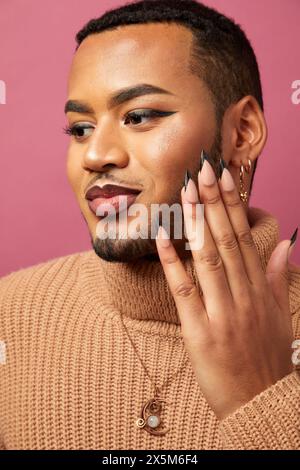 Studio portrait of queer man against purple background Stock Photo - Alamy