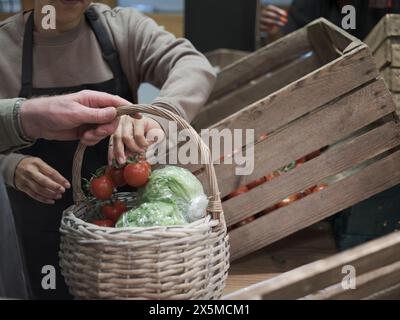 Volunteers sorting vegetables in community food center Stock Photo - Alamy