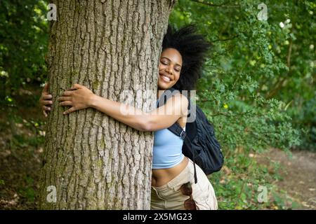 young woman hiking in forest mountain Stock Photo - Alamy