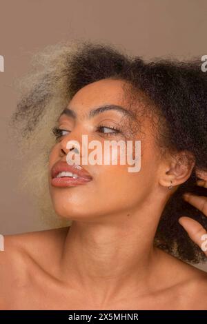 Studio portrait of woman with two toned hair Stock Photo - Alamy