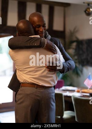 Mature brothers hugging at home Stock Photo - Alamy