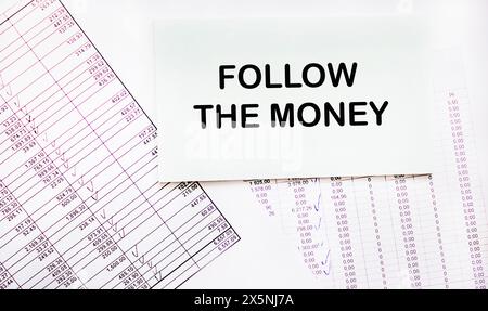 Business concept. On the business charts lies a magnifying glass, a pen ...