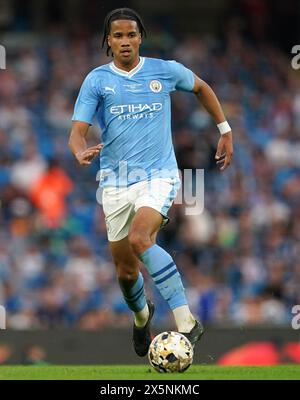 Divine Mukasa #10 of Manchester City challenged by the opponent during ...