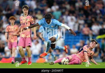 Manchester City's Joel Ndala challenges by Leeds United's Connor ...