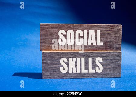 Social skills words written on wooden blocks with red background ...