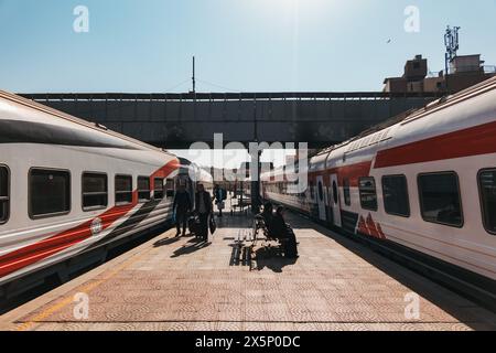 On the platform between two Egyptian Railways carriages in Aswan, a ...