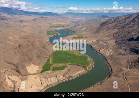 Vertical view surface of river among the mountains. Aerial photo from ...