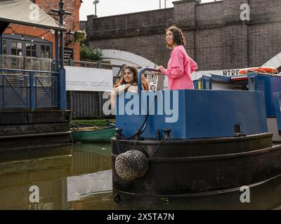 Two female friends at the stern of boat Stock Photo - Alamy
