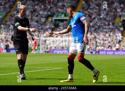 Referee William Collum with an object that was thrown from the stands ...