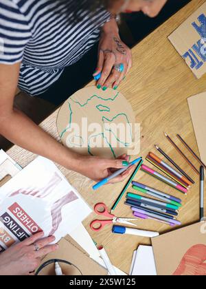 Woman making protest signs with symbols of peace Stock Photo - Alamy
