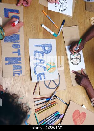 People making protest signs with symbols of peace Stock Photo - Alamy