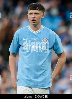 Manchester, UK. 10th May, 2024. Divine Mukasa of Manchester City (L) is ...