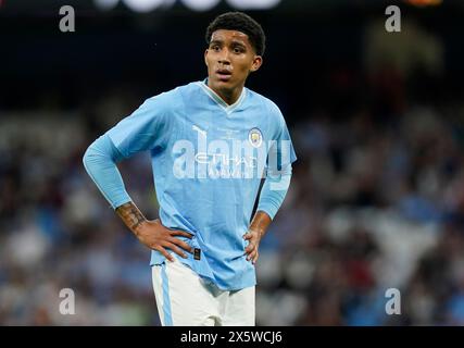 Manchester, UK. 10th May, 2024. Divine Mukasa of Manchester City (L) is ...