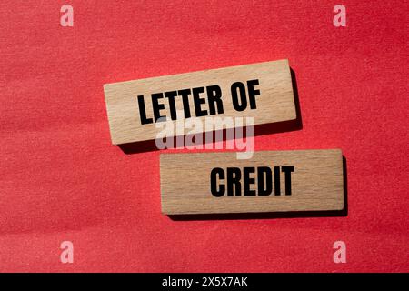 Letter of credit words written on wooden blocks with pink background ...