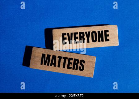 Everyone matters words written on ripped paper with notebook page ...