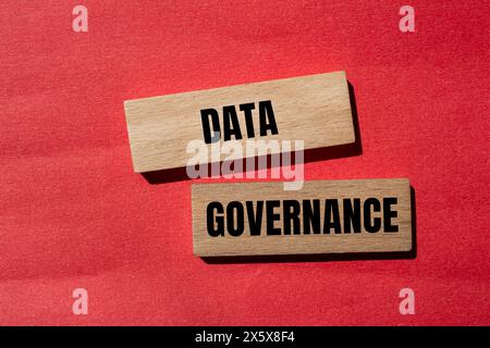 Data governance words written on ripped yellow paper with blue ...