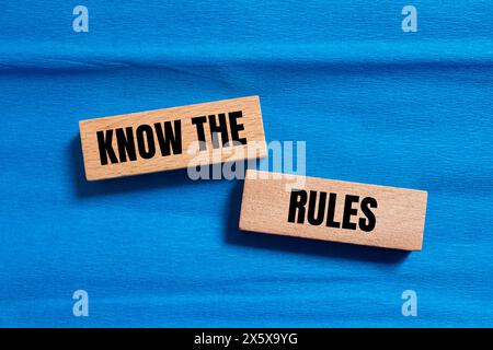 Know the rules words written on wooden blocks with blue background ...