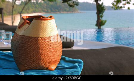 Umbrella and chair beside a pool Stock Photo - Alamy