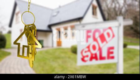Image of gold house key fob and key, hanging in front of blurred city ...