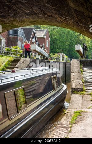 Canal narrowboat passing through Tyrley locks on the Shropshire union ...
