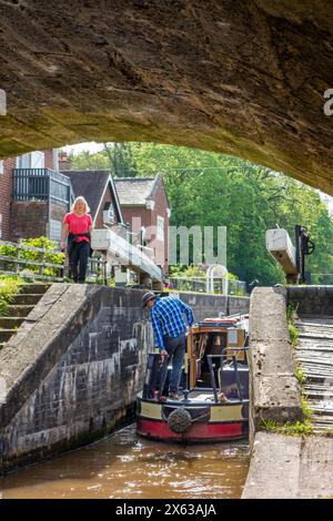 Canal narrowboat passing through Tyrley locks on the Shropshire union ...