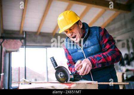 Sawing into finger with circular saw. Injured worker with wound hand ...