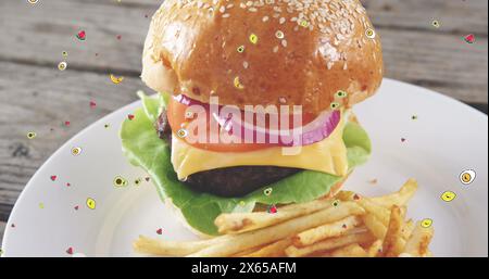 Image of falling food over burger and chips Stock Photo - Alamy