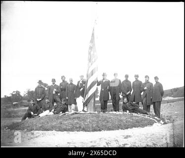 Signal Corps officers lowering the flag at their camp near Georgetown ...