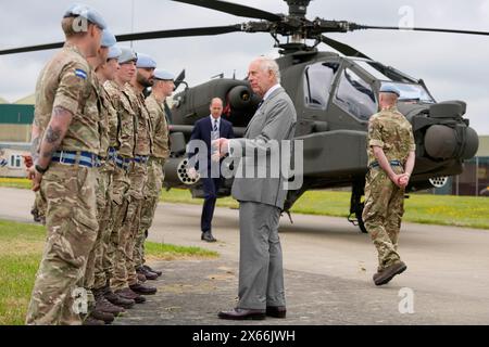 King Charles III speaks with Colonel Erica Bridge during a reception ...