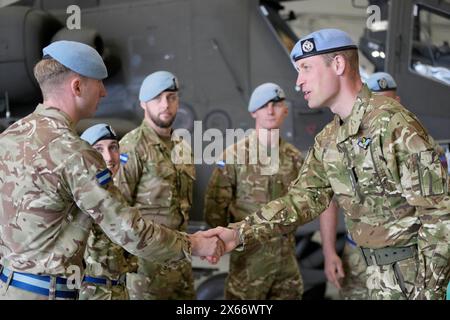 King Charles III speaks with Colonel Erica Bridge during a reception ...