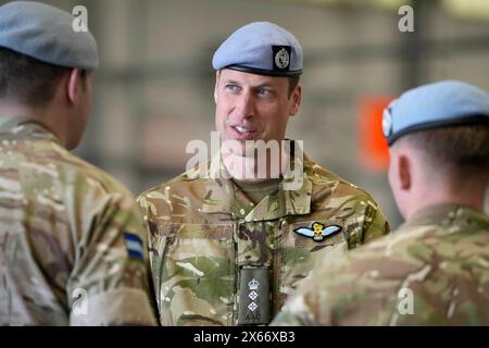 King Charles III speaks with Colonel Erica Bridge during a reception ...