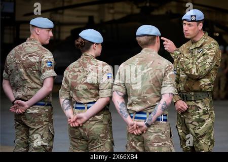King Charles III speaks with Colonel Erica Bridge during a reception ...