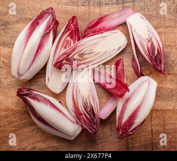 Red endive and cross section of endive on white background. File ...
