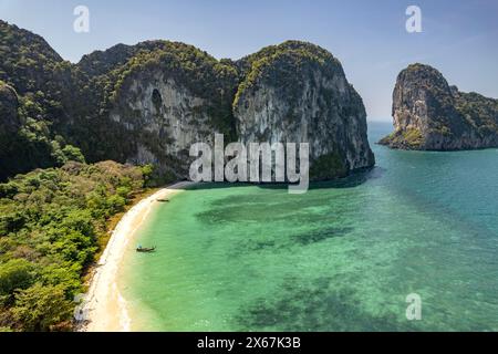 Steep karst cliffs and beach on the islands of Koh Lao Liang, Thailand ...
