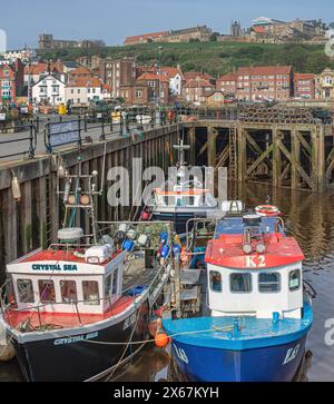 A fishing boat's name is reflected in the waters of Cockrell Creek in ...