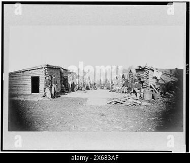 Union soldiers, in camp, posed in front of log buildings, Civil War ...