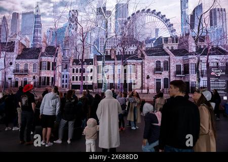 People interact with large scale digital screens displaying Spring ...