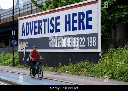 Large scale advertising billboard poster which reads Advertise here to ...