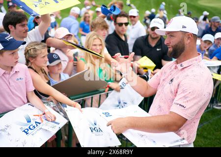 Jon Rahm of Spain signs autographs for fans during a practice round ...