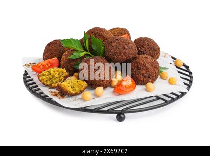 Stand with delicious falafel balls, chickpea and tomato on white ...