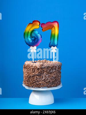 Multicolored balloon for number 67 celebration. Happy birthday on white ...