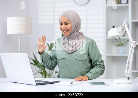 Teleconference. Smiling Young Muslim Woman Making Video Call With ...
