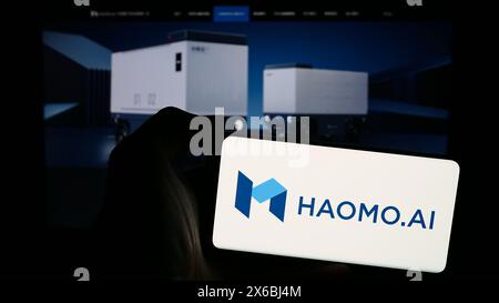 Mobile phone with logo of Chinese autonomous driving company Haomo.AI ...