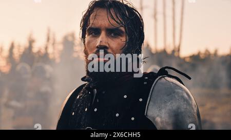 Medieval Knight on Battlefield, Looking at Camera, his Helmet is Open ...