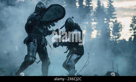 Dark Age Battlefield: Two Armored Medieval Knights Fighting with Swords ...
