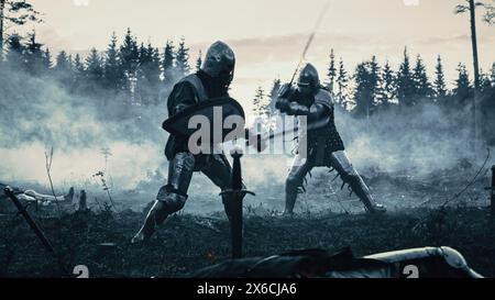 Dark Age Battlefield: Two Armored Medieval Knights Fighting with Swords ...