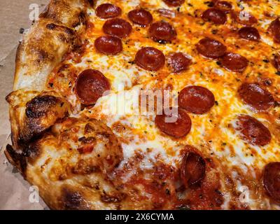 A close up view top of a melted multi colored cupcake with decor ...