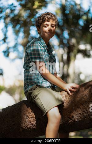 Child in a green plaid shirt cutting a banana with a safe kids plastic ...