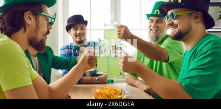 Beer glasses with leprechaun hat, shamrock clover leaves, traditional ...