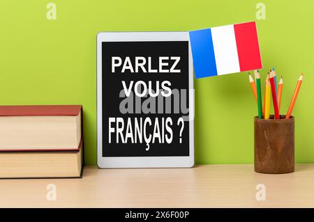 A digital tablet with the question parlez-vous francais? do you speak ...
